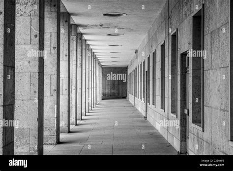 A Vanishing Perspective View Of A Modern Arcade With Evenly Spaced