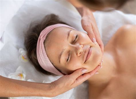 Young Woman Getting Facial Massage In Salon Stock Image Image Of