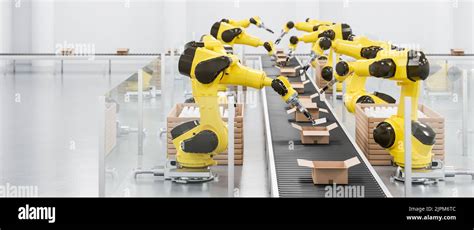 Robots At A Conveyor Belt Packing Items Into Cardboard Packages Stock