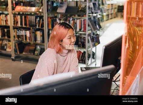 Woman Using Computer In Library Stock Photo Alamy