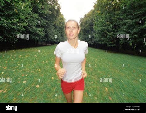 Woman Running Front View Stock Photo Alamy