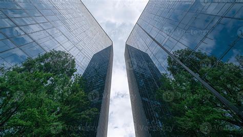 Stunning Glass Towers Reflecting Greens And Clouds Above 72260171 Stock