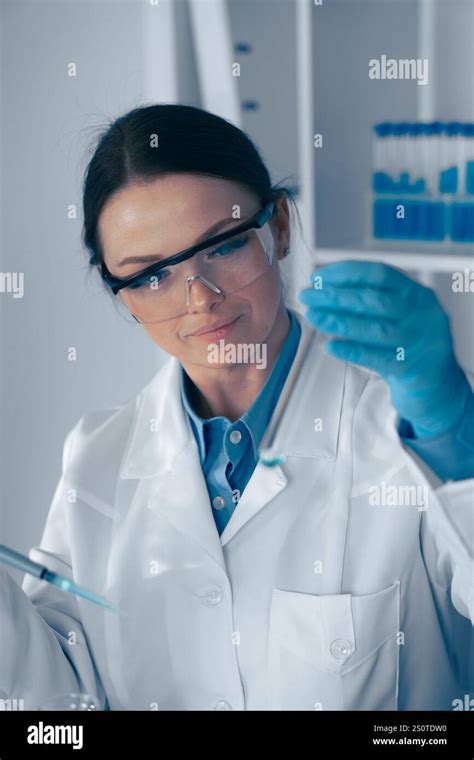 In A Wellequipped Lab A Dedicated Scientist Analyzes A Complex Biological Sample Using Her