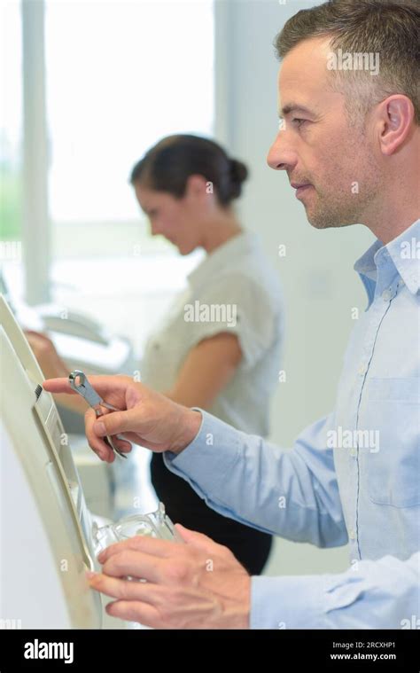 Technician Using Control Panel Holding Pliers Stock Photo Alamy