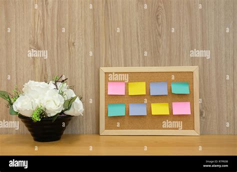 Sticky Notes Paper Reminder On Cork Board On Wooden Desk Bulletin