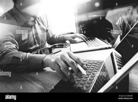 outsource developer working on marble desk working laptop computer