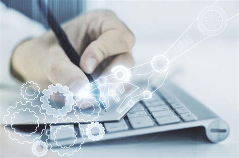 노트북 연구 및 개발 소프트웨어 개념을 사용하여 백그라운드에서 노트북에 로봇 기술 홀로그램 및 손 쓰기의 이중 노출 프리미엄 사진