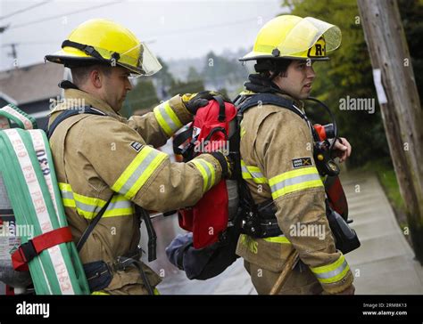 Firefighters Check With Each Other Their Equipments Before Entering A