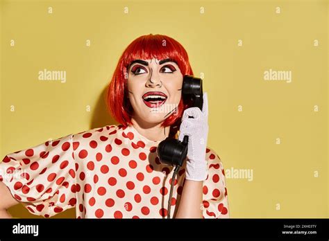 A Vibrant Redhead Woman In Comic Inspired Makeup Chats On A Phone