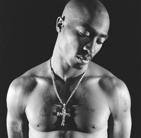Iconic 2pac Tattoos Across His Body A Symbol Of Art And Legacy