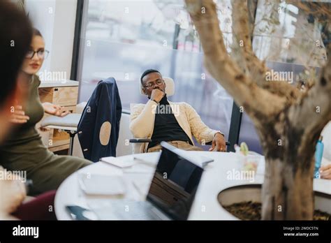 Diverse Colleagues Analyzing Statistics Brainstorming Ideas And Strategizing For Business