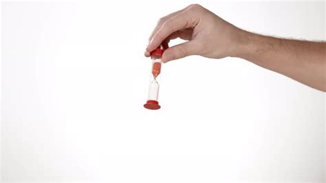 Time Begins A Mans Hand On A White Background Of Isolate Holds An