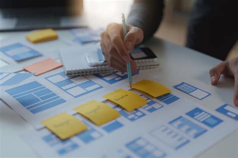 Premium Photo Group Of Ux Ui Or Designers Working To Create Content Of Mobile Applications