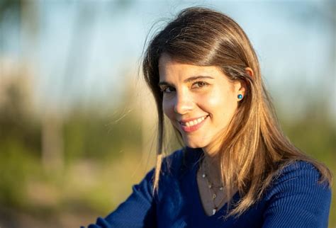 Premium Photo Closeup Of A Woman Looking At Camera And Smiling While