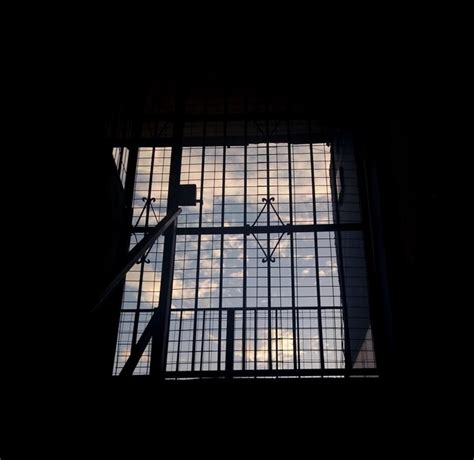 Premium Photo Low Angle View Of Glass Window In Darkroom