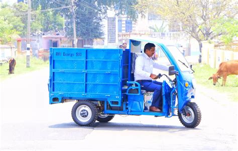A Collector Driving A Garbage Collection Vehicle குப்பை சேகரிக்கும்