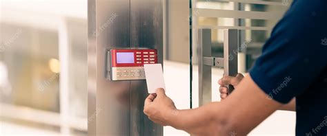 Premium Photo Close Up Hand Security Man Using Id Card Scanning At