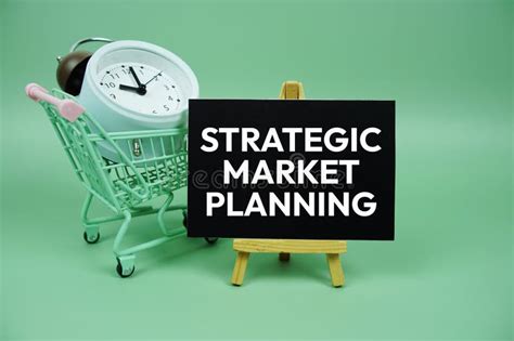 strategic market planning text message on paper card with alarm clock