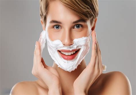 Premium Photo A Man With A White Beard Is Holding A White Foam On His