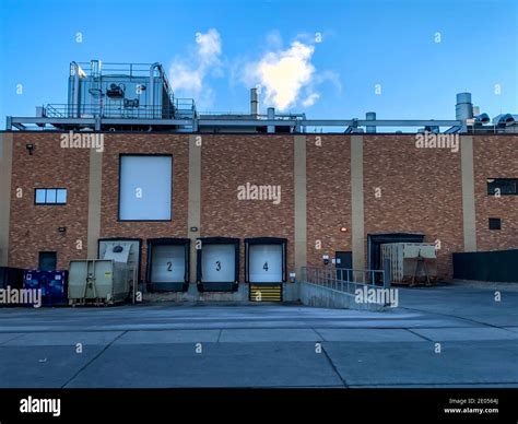 Industrial Setup For Loading And Unloading Material Through Secure Elevated Bay Doors Stock