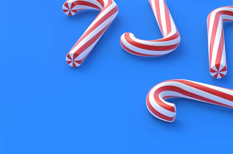 흩어져있는 크리스마스 지팡이 파란색 배경에 빨간 줄무늬가있는 사탕 새해 축하 개념 전통적인 달콤한 디저트 공간을 복사합니다 3d 렌더 크리스마스에 대한 스톡 사진 및 기타