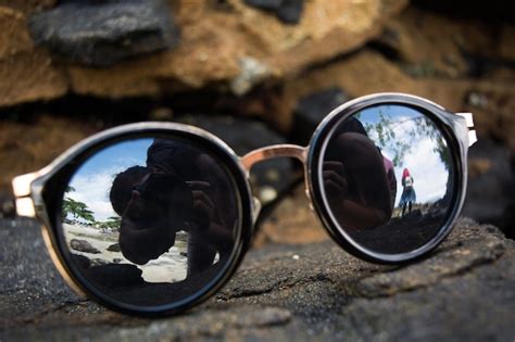 Premium Photo Close Up Of Sunglasses On Side View Mirror