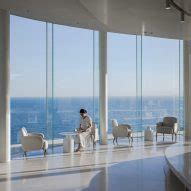 Andwich Design Tops Clifftop Library In China With Circular Pool