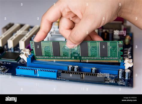 Technician Installing RAM Stick Random Access Memory To Socket On