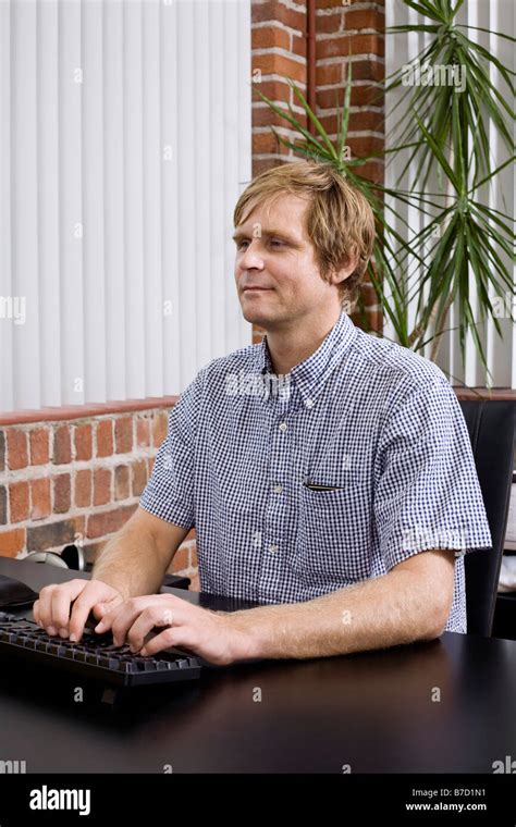 A Man Typing On A Computer Keyboard Stock Photo Alamy