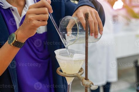 Experiment To Separate Mixed Substances By Pouring Substances Into A Separator Funnel Through