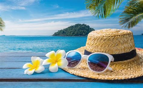 Premium Photo A Hat And Sunglasses On A Beach Backgrounda Hat And