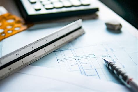 Premium Photo Close Up Of Blueprint On Table