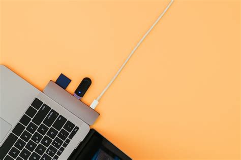 Premium Photo Modern Laptop Usb Type C Adapter With A Flash And Charging On Orange Surface