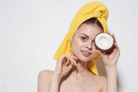 Pretty Woman With Yellow Towel On Her Head Holding Hands Coconut Exotic Clean Skin Spa 21991520
