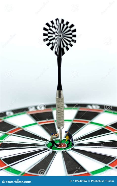 Dart Arrow Hitting In The Target Center Of Dartboard Using As Ba Stock