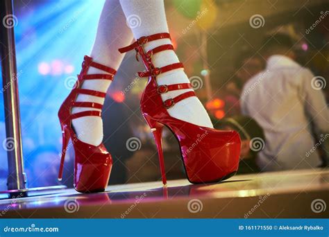 Young Woman Pole Dancing Striptease With Pylon In Night Club Beautiful