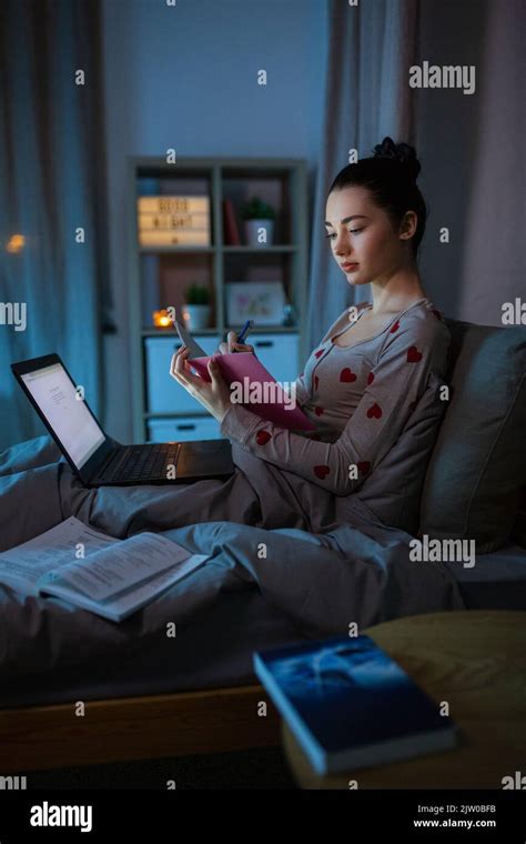 Babe Girl With Notebook And Laptop At Night Stock Photo Alamy