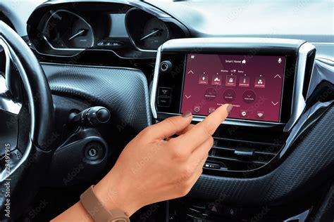 Female Driver Setting Home Temperature Safety And Environment Control On Car Display Stock