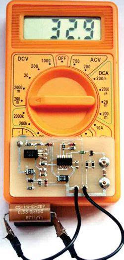 фотография приставки с мультиметром Электронная схема Принципиальная схема Электроника