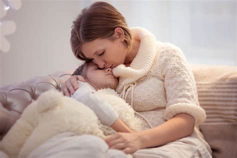 The Girl Got Sick Mom Hugs And Kisses A Sick Daughter Stock Image