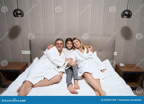 Father And Mother Resting Near Girl In The Motel Stock Image Image Of