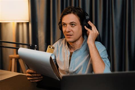 broadcaster reading script note to listener in warm light at night