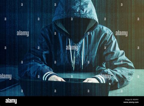 Anonymous Hacker Programmer Uses A Laptop To Hack The System Stealing Personal Data Creation