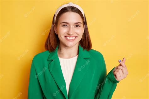 Premium Photo Cheerful Optimistic Woman Wearing Green Jacket Posing