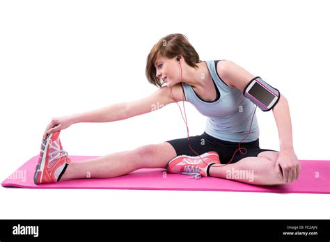 Pretty Brunette Doing The Hamstring Stretch On Exercise Mat Stock Photo Alamy
