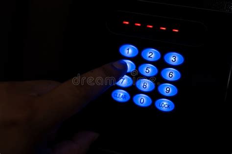 People Hand Is Unlocking To Open The Safe Box Door By Pressing Password