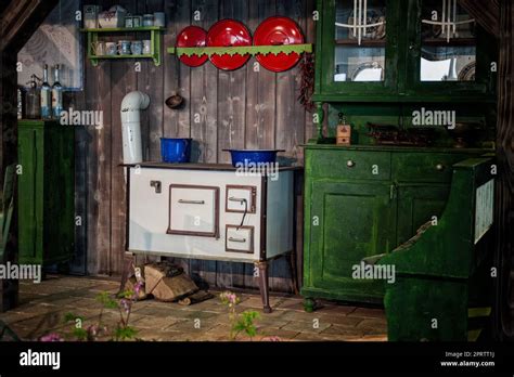 Traditional Rustic Interior Of A Rural Kitchen With Old Wood Stove Plates And Dishes Stock