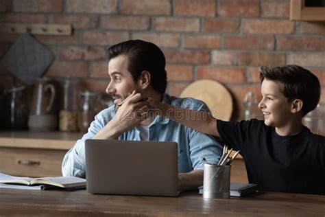 Small Teen Son Distract Dad From Working At Home Stock Image Image Of