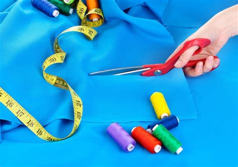 Premium Photo Woman Cutting Fabric