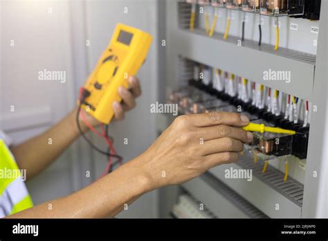 Electrician Engineer Work Tester Measuring Voltage And Current Of Power